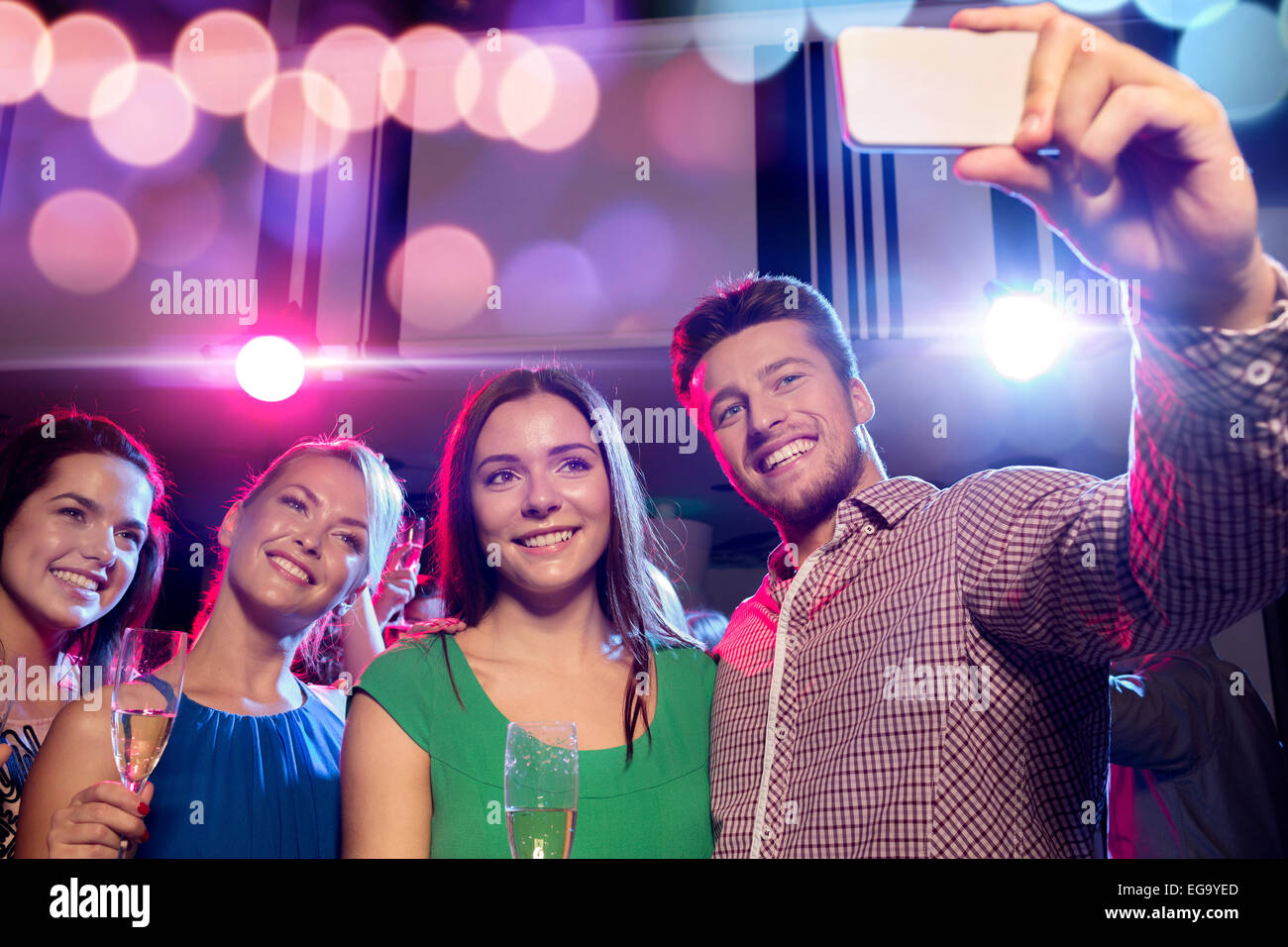 friends with glasses and smartphone in club Stock Photo - Alamy