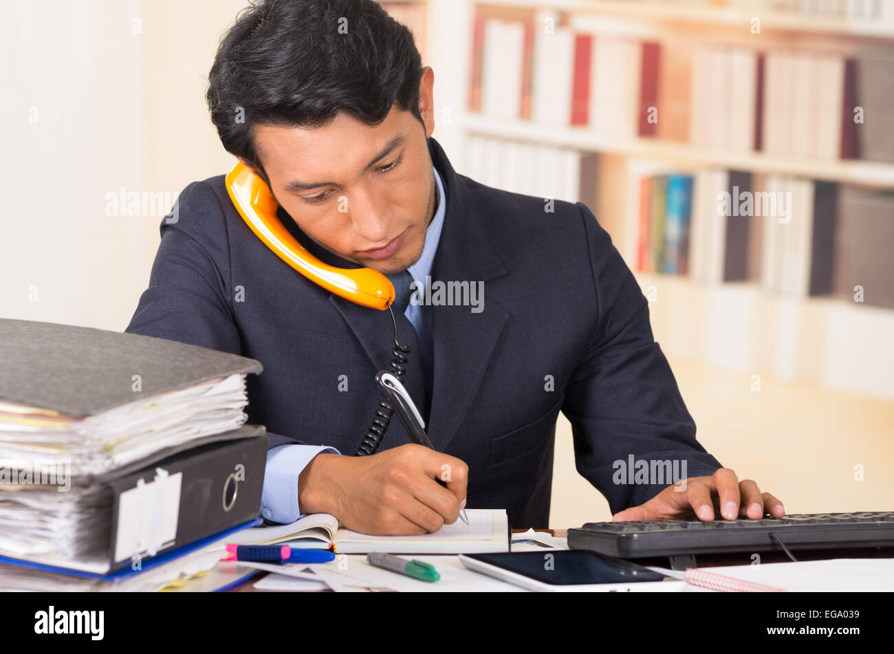 young stressed overwhelmed man with piles of folders on his desk Stock ...