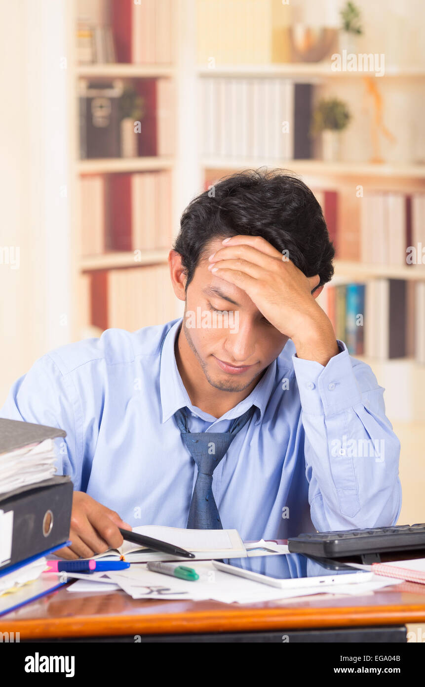 young stressed overwhelmed man with piles of folders on his desk Stock ...