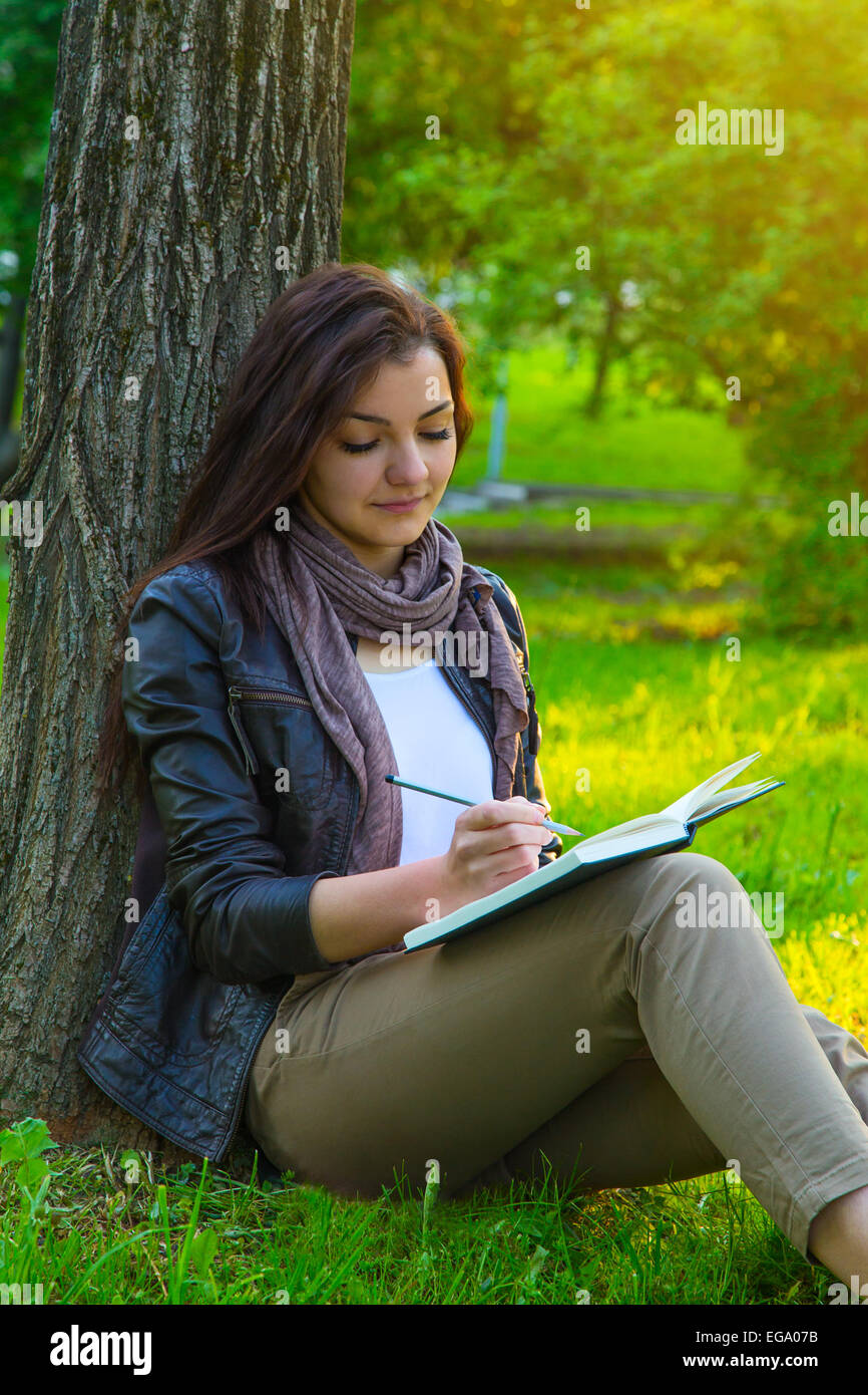 beautiful sunny portrait of a girl book Stock Photo - Alamy