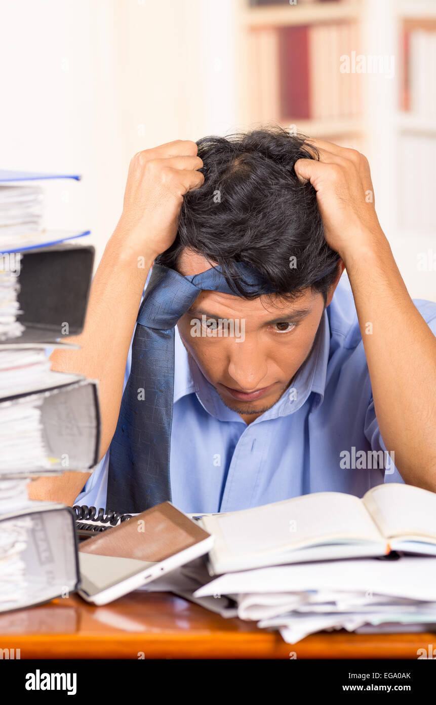 young stressed overwhelmed man with piles of folders on his desk Stock ...