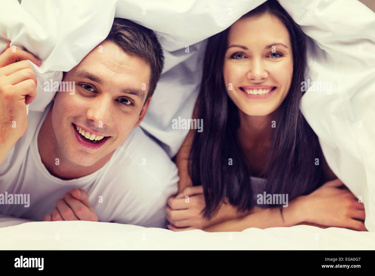 happy couple sleeping in bed Stock Photo - Alamy