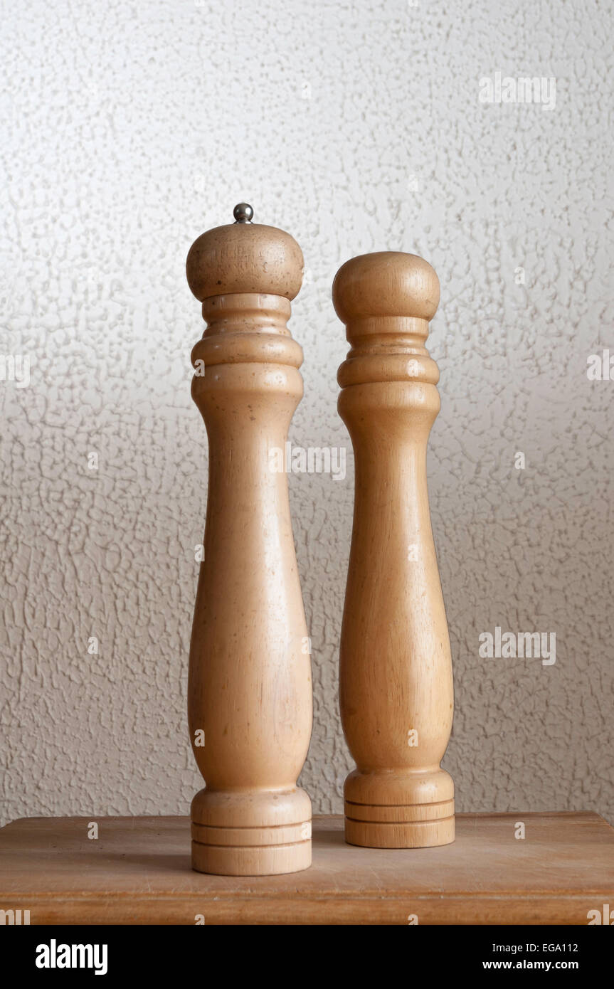 Wooden salt ant pepper condiments set with light artex behind Stock ...