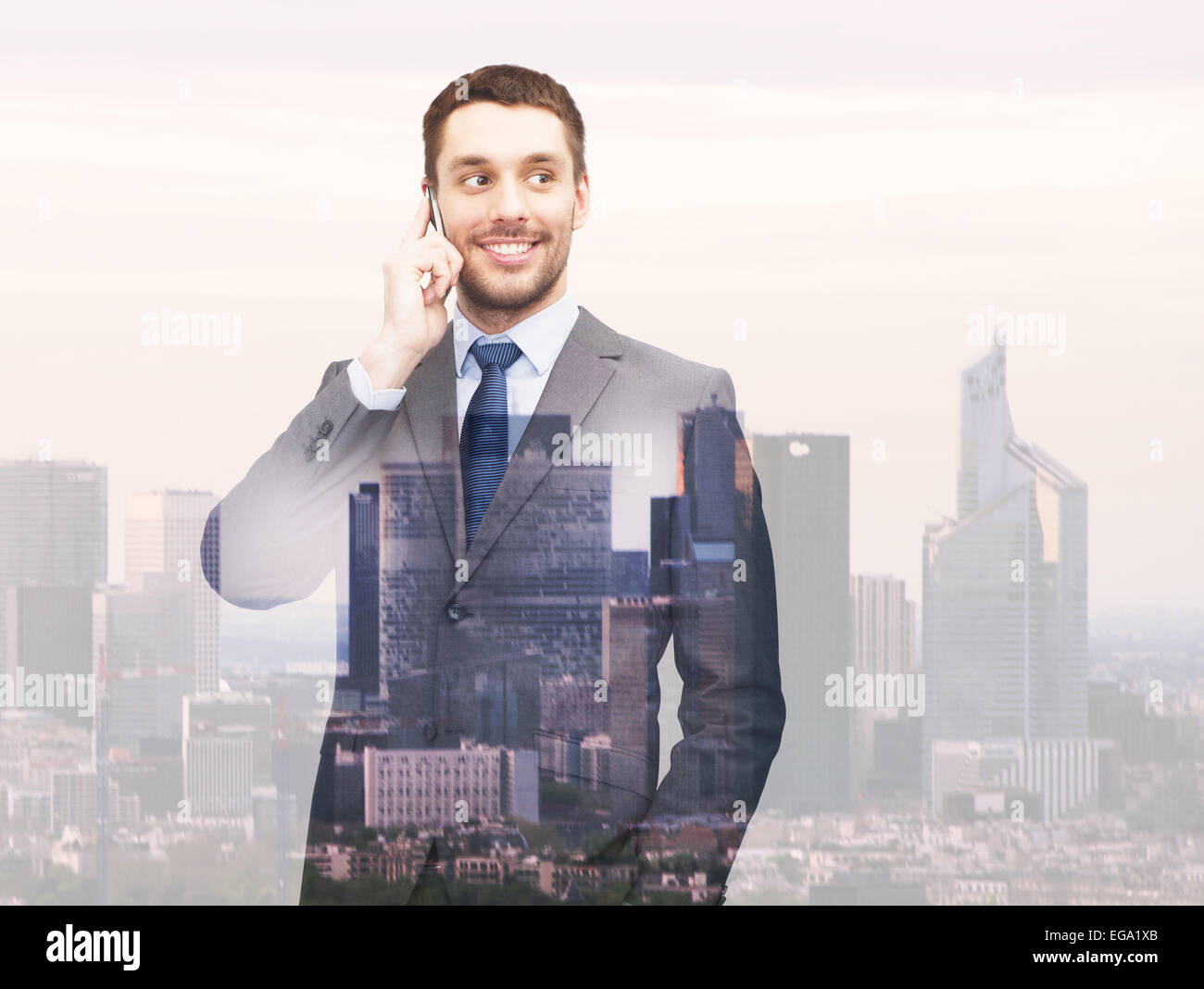 smiling young businessman over city background Stock Photo - Alamy
