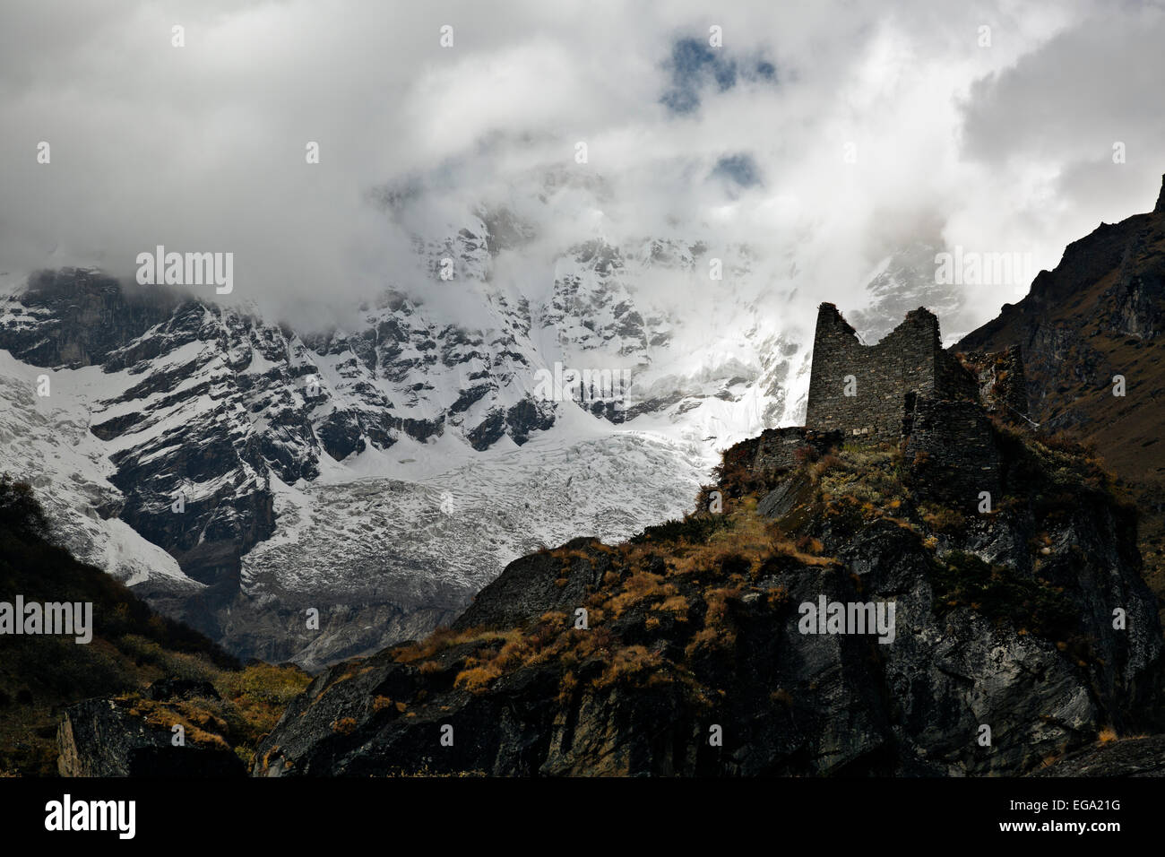 BHUTAN - A cloud covered Jhomolhari and very old watchtower guard over ...