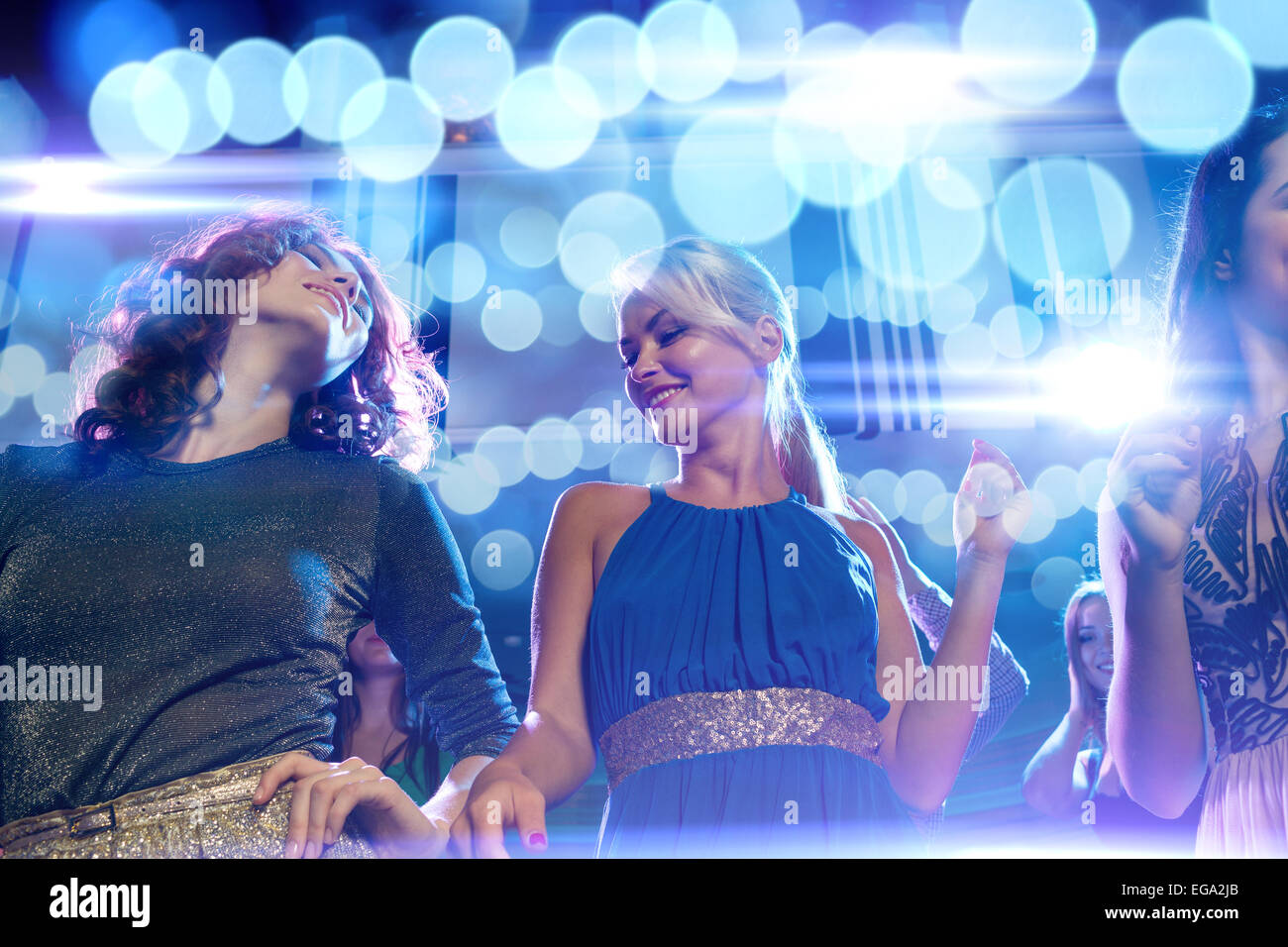 smiling friends dancing in club Stock Photo - Alamy