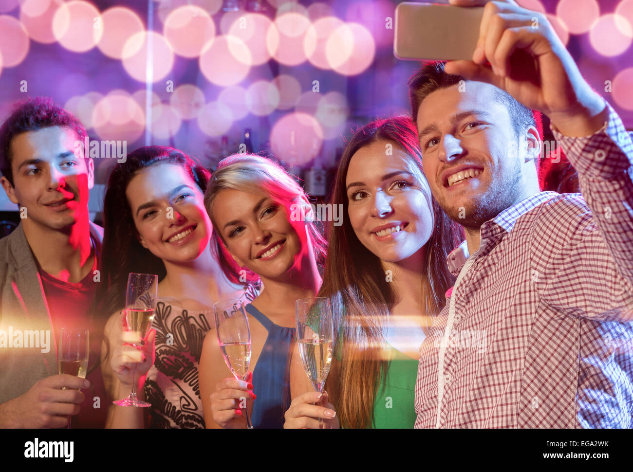 friends with glasses and smartphone in club Stock Photo - Alamy