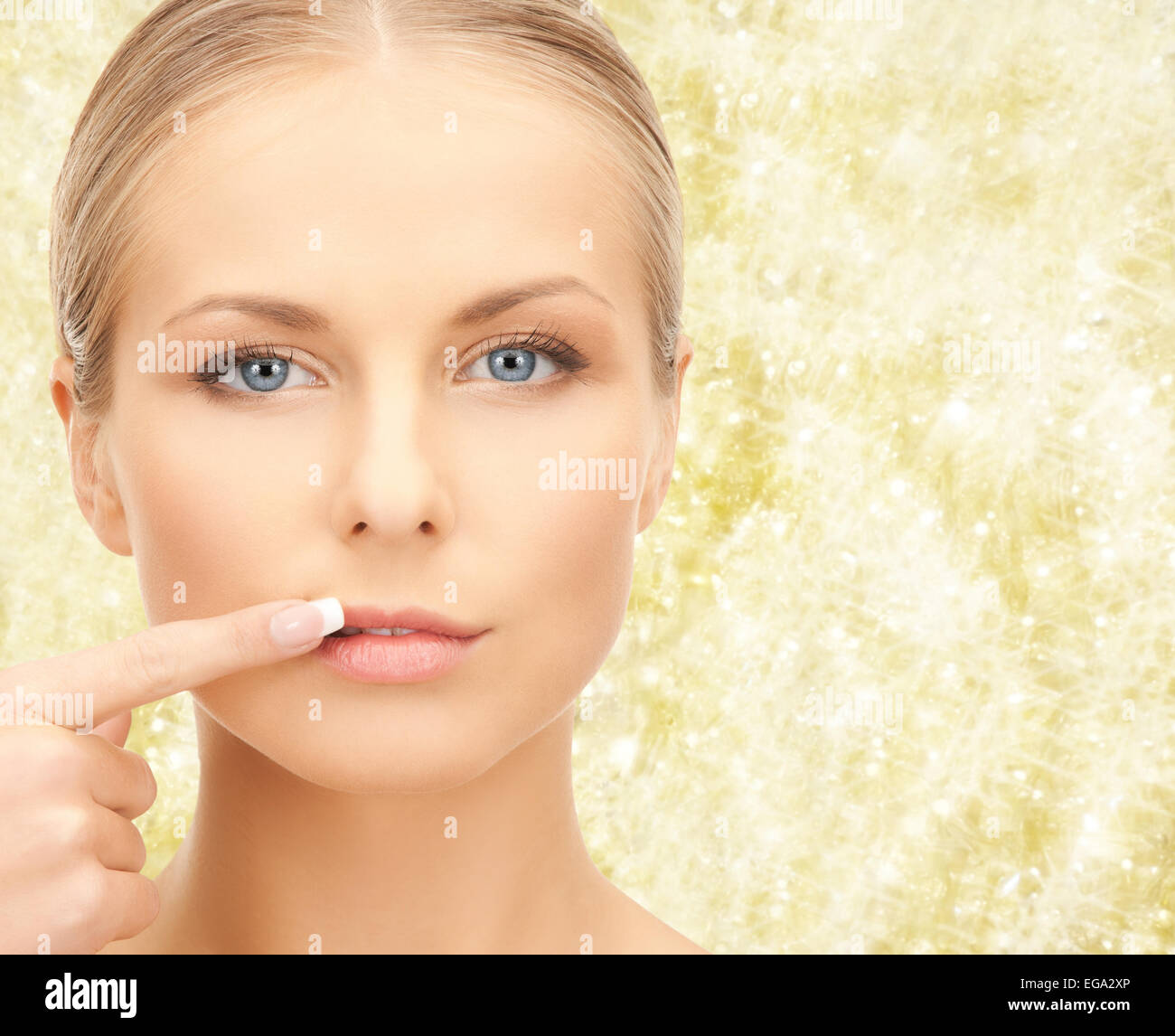 beautiful young woman pointing finger to her lips Stock Photo - Alamy