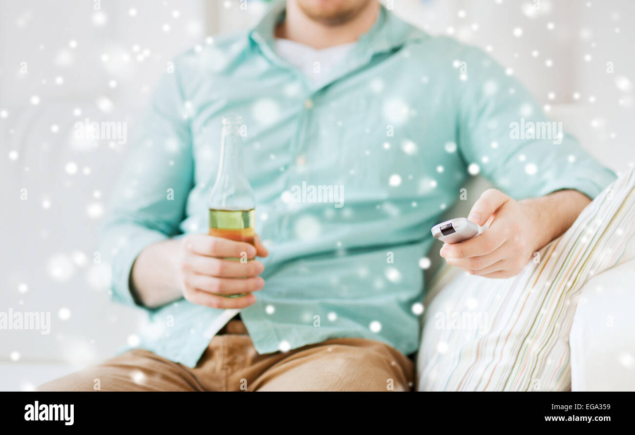 man with beer and remote control at home Stock Photo - Alamy