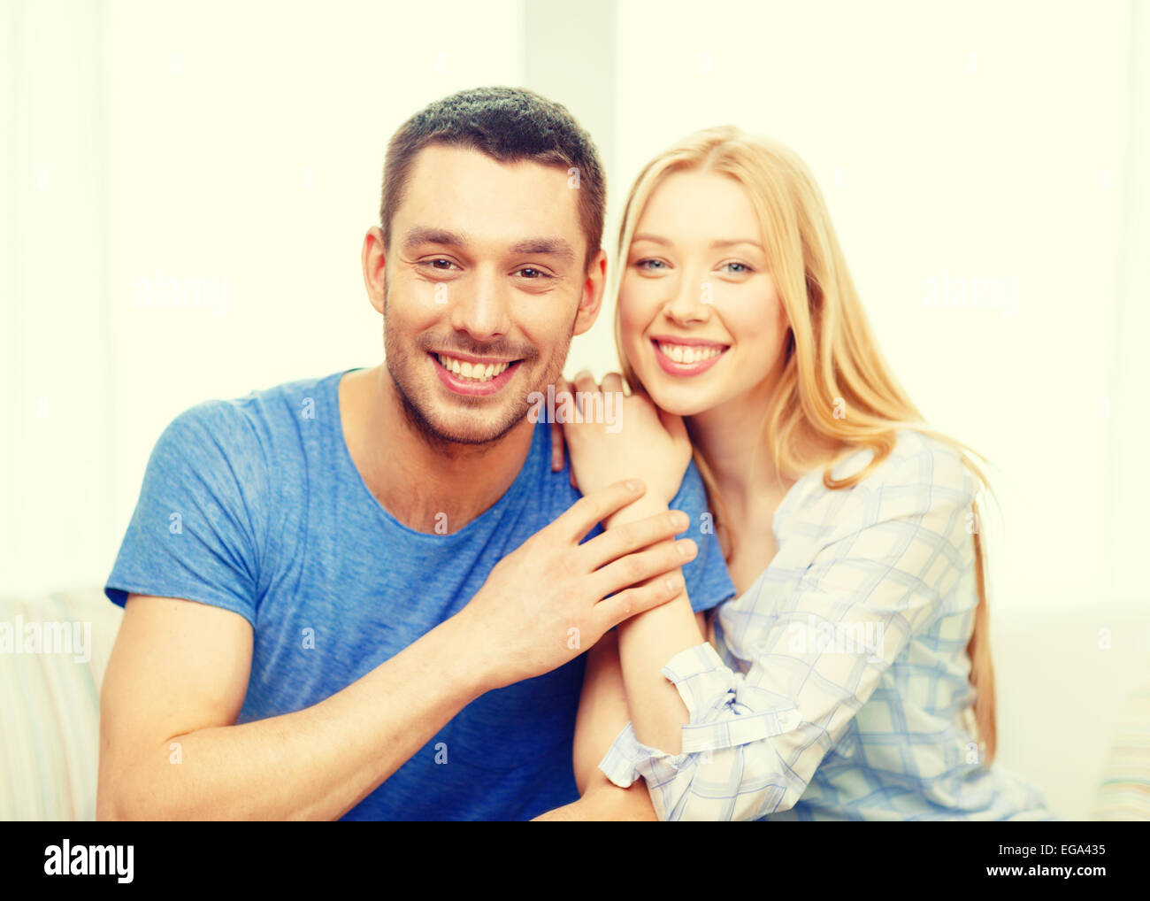 smiling happy couple at home Stock Photo - Alamy