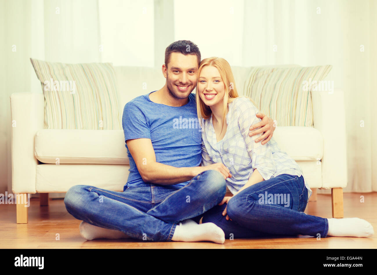 smiling happy couple at home Stock Photo - Alamy