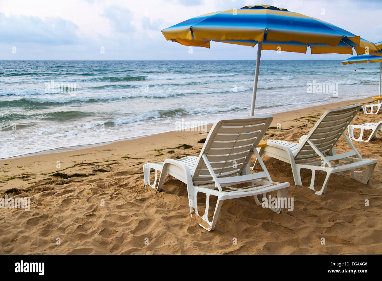 beach chair umbrella parasol sun lounger sea Stock Photo - Alamy