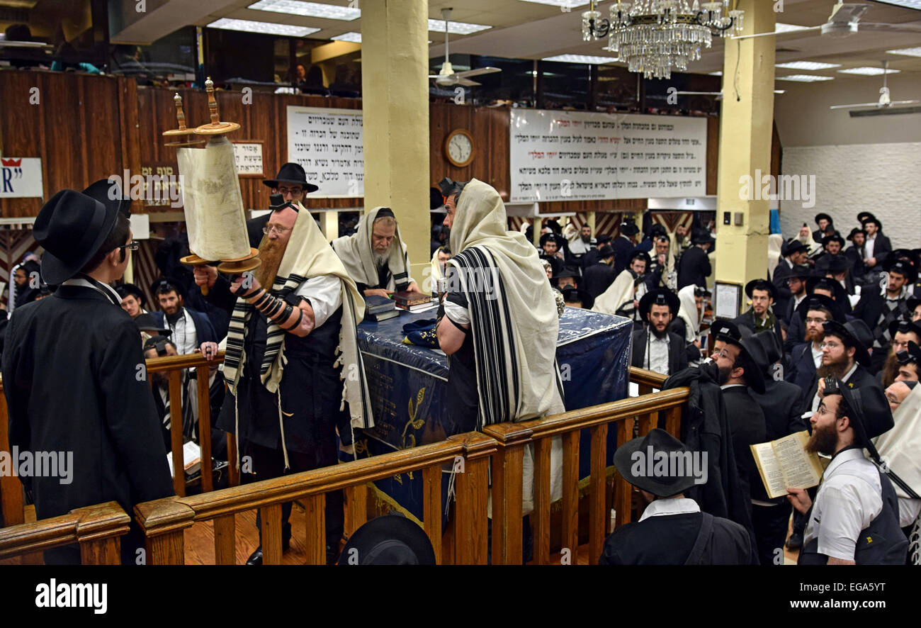 After a Torah reading a religious Jewish man shows the scroll to the ...