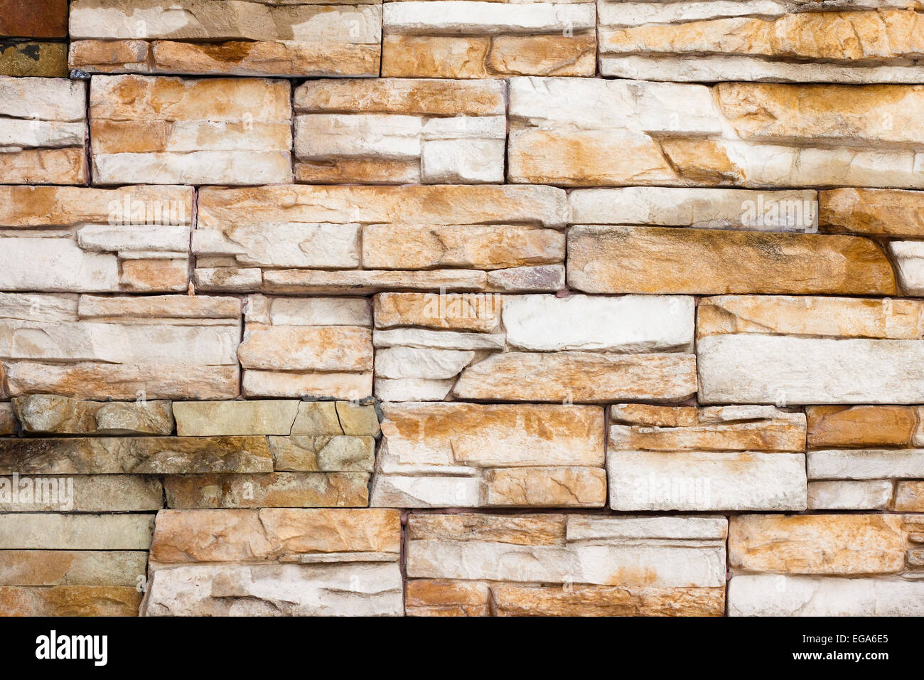 External brown stone wall background Stock Photo - Alamy