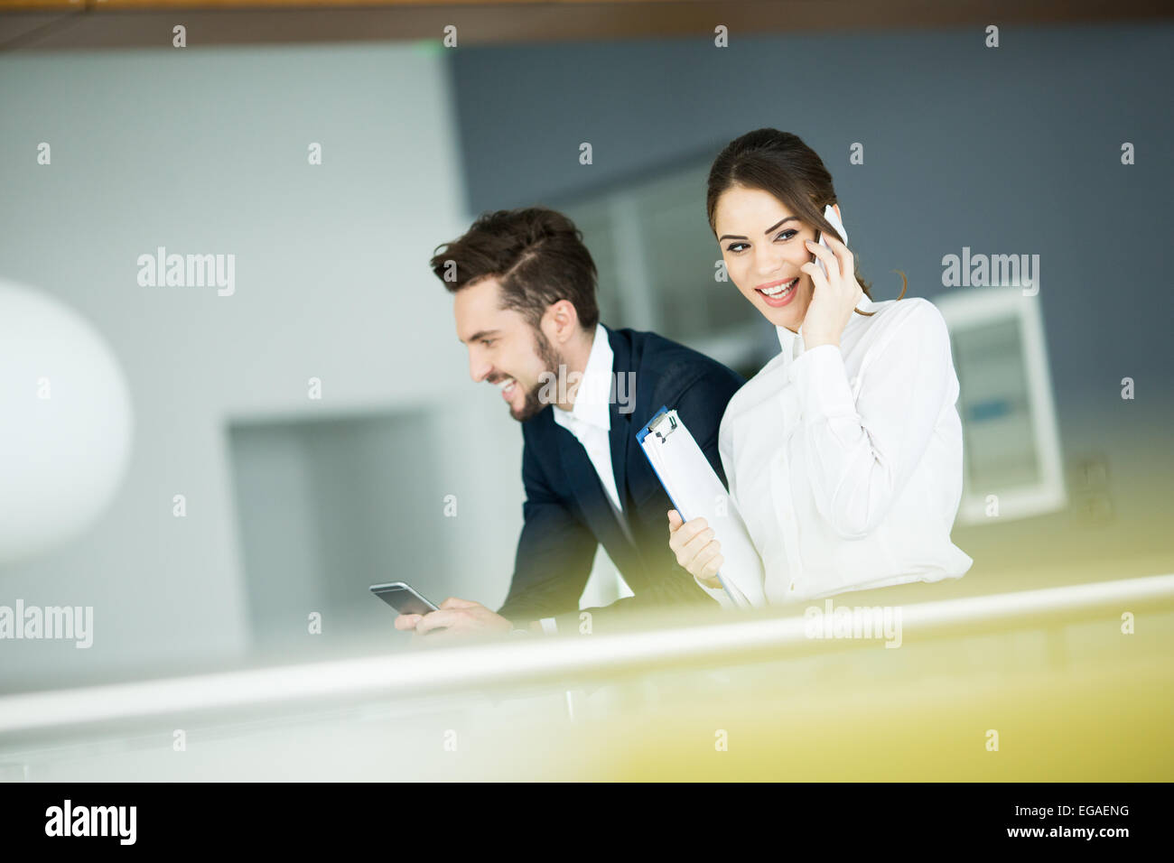 Young couple working in the office Stock Photo - Alamy