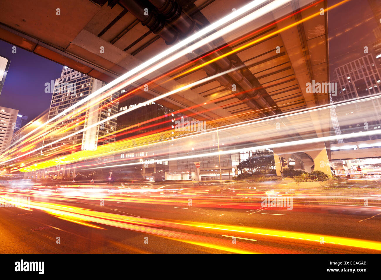 Traffic trails of double decker traveling on a busy road Stock Photo ...