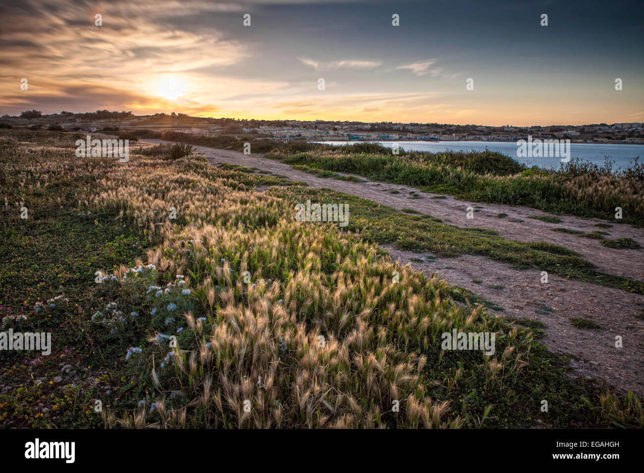 A beautiful spring sunset over the idyllic setting of St. Thomas Bay in ...