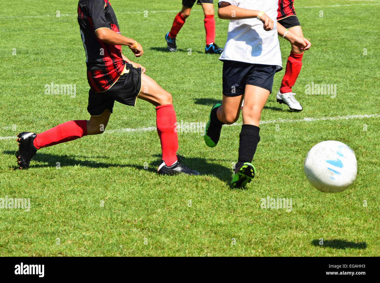 Kids are playing soccer Stock Photo - Alamy