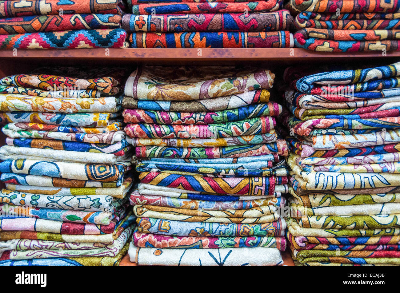 Colorful fabrics on display in a shop Mutrah Souk, in Mutrah, Muscat ...