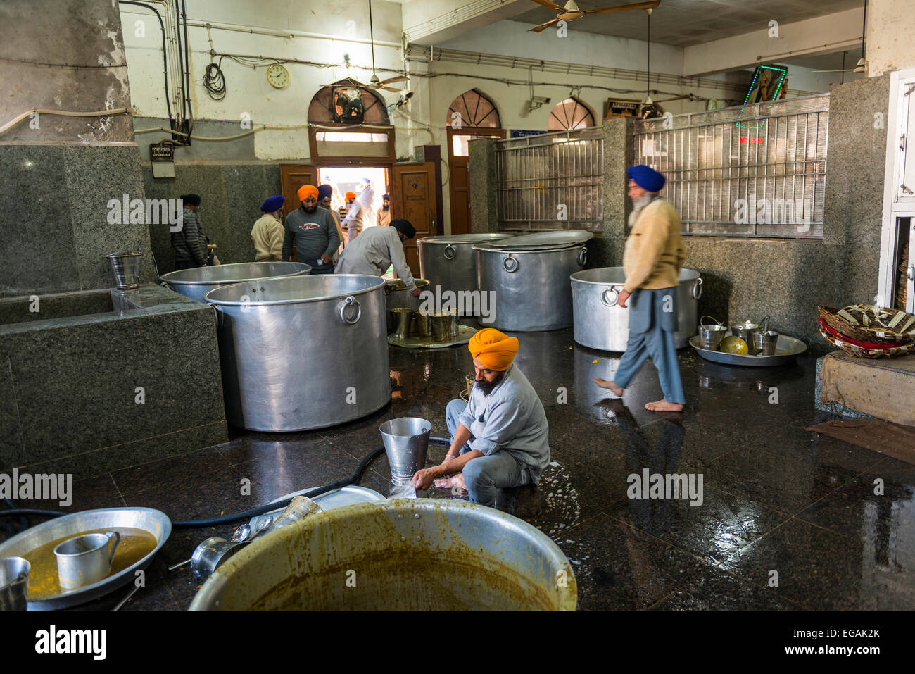 Volunteers working in the kitchens of the communal dining room of The ...