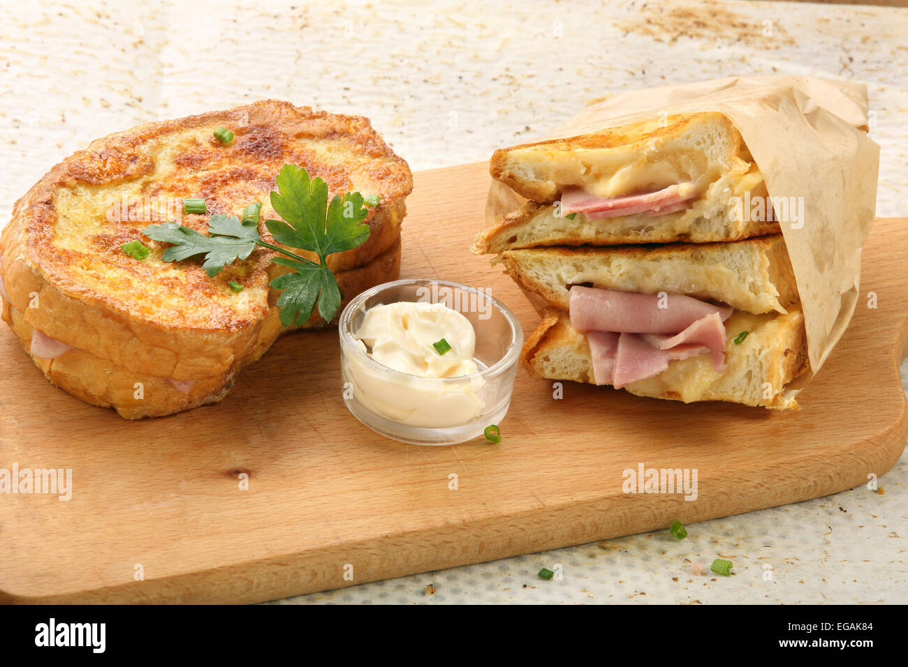 Toast with ham and cheese on a chopping board Stock Photo - Alamy