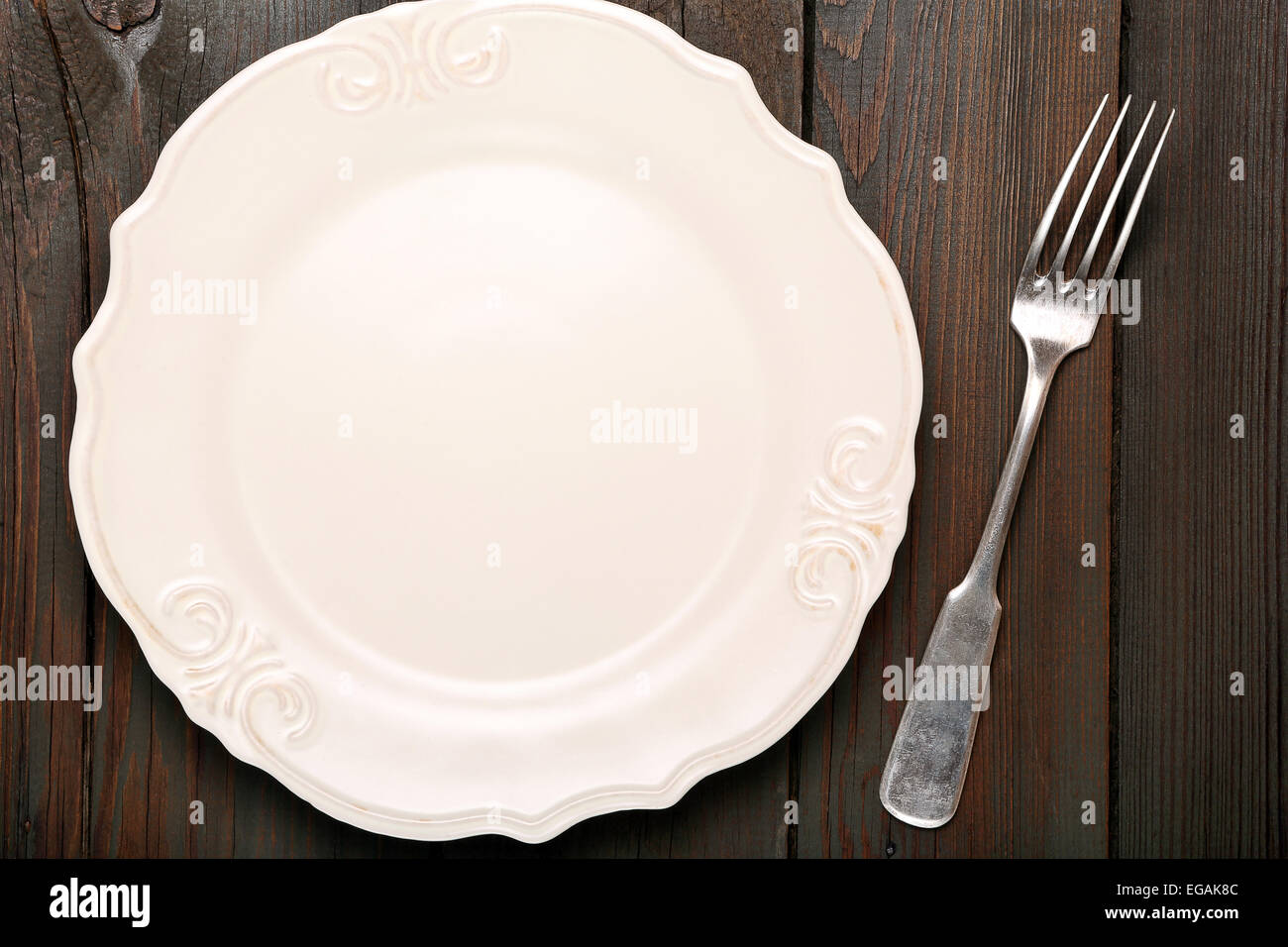 Empty dinner plate with space for text on a wooden background Stock ...