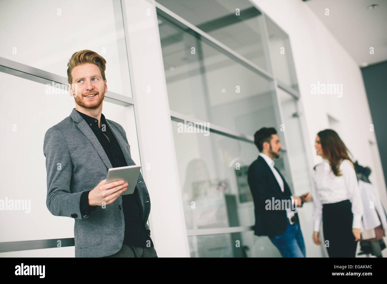 Young people in the office Stock Photo - Alamy