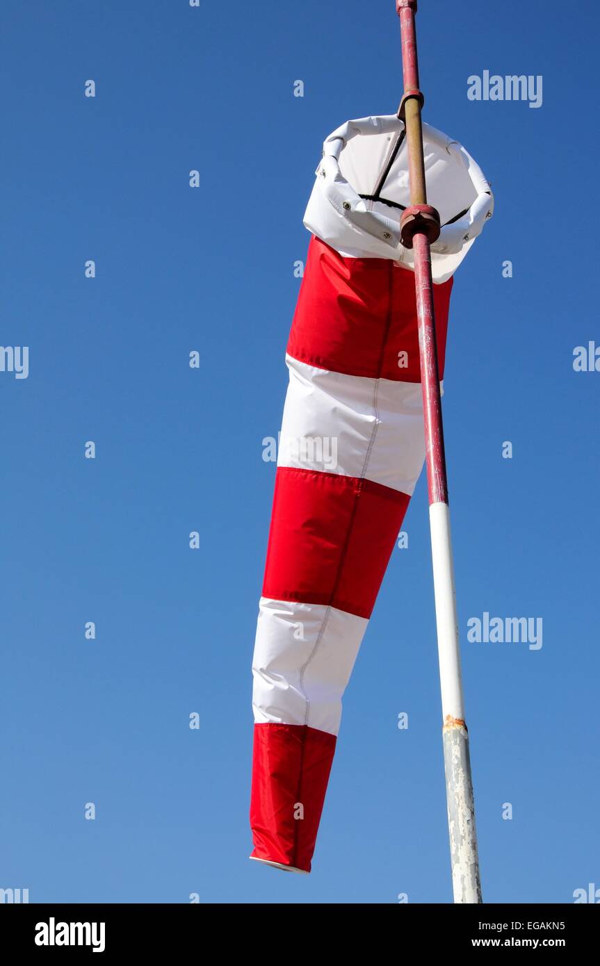 Red and white windsock against a blue sky Stock Photo - Alamy