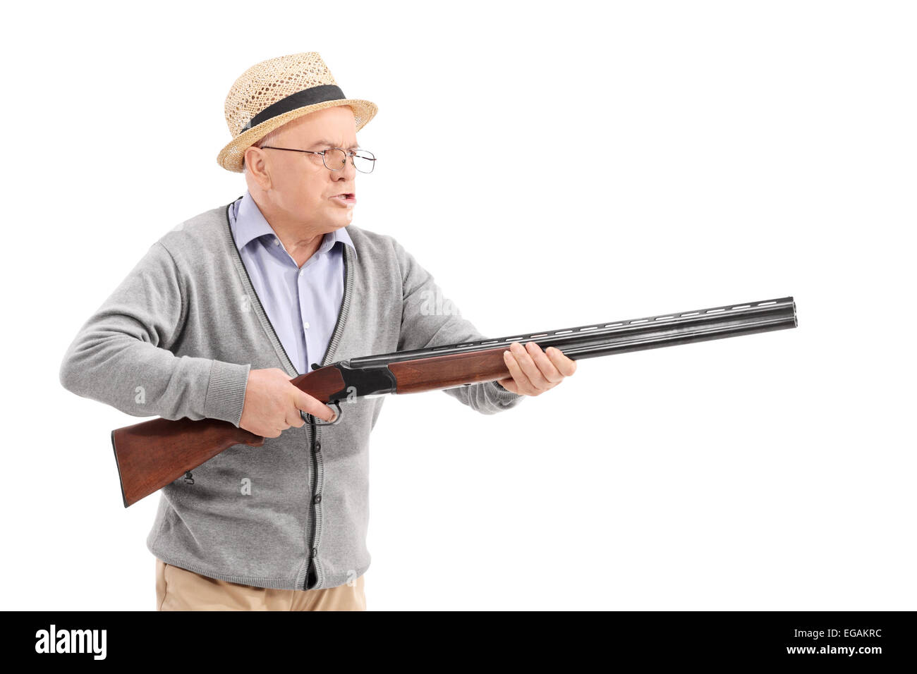 Angry senior holding a rifle isolated on white background Stock Photo ...