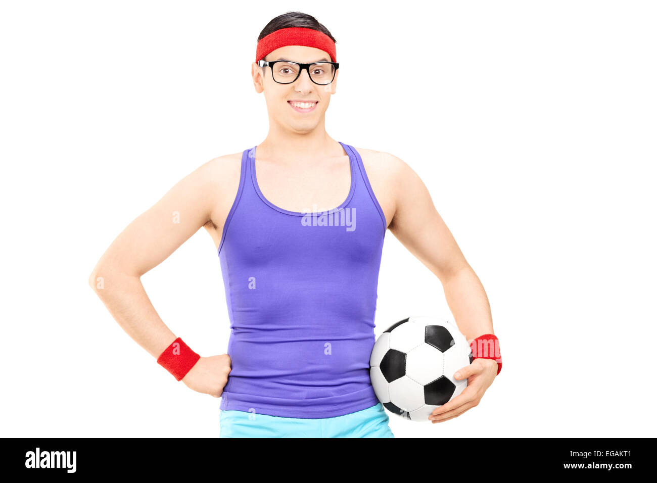 Nerdy athlete holding a football isolated on white background Stock ...