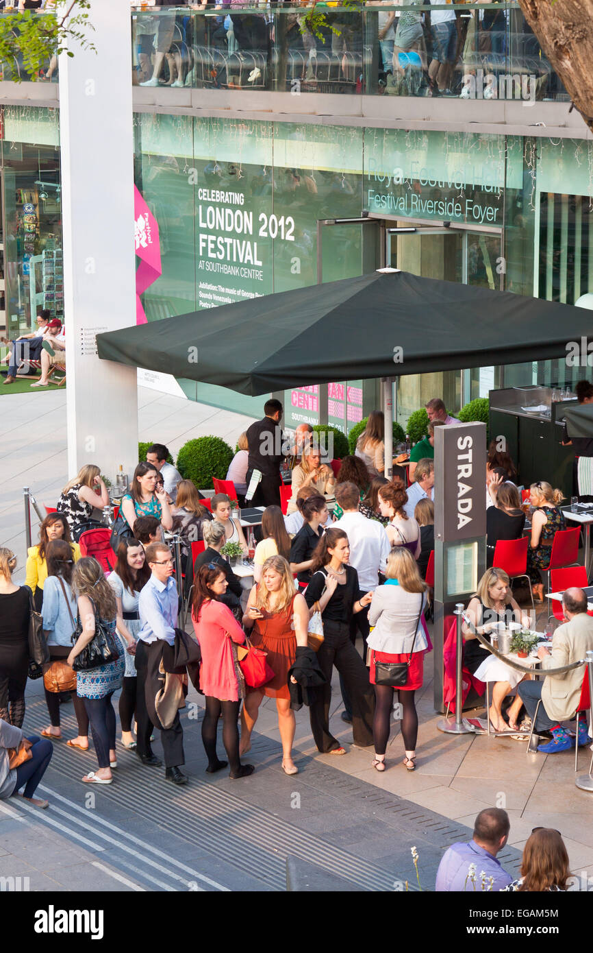 People queue outside the Strada restaurant on London's South Bank Stock ...