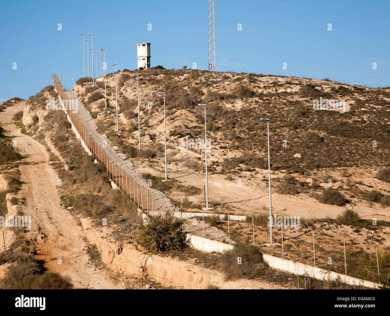 Security fence and look-out tower of military base in Melilla ...
