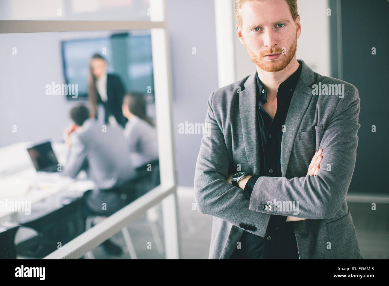 Young man in the office Stock Photo - Alamy