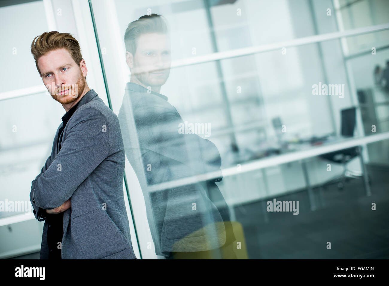Young man in the office Stock Photo - Alamy