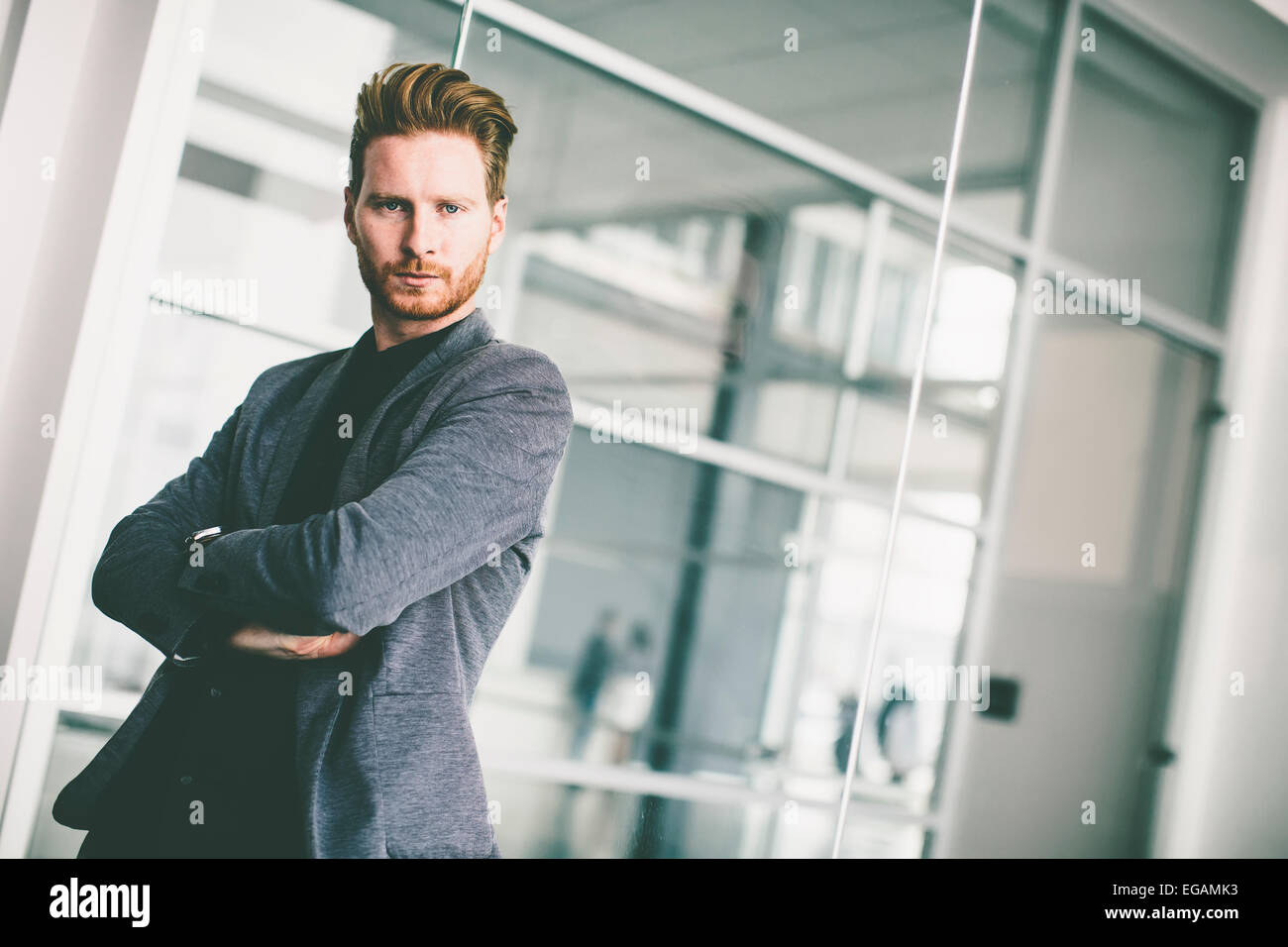 Young man in the office Stock Photo - Alamy