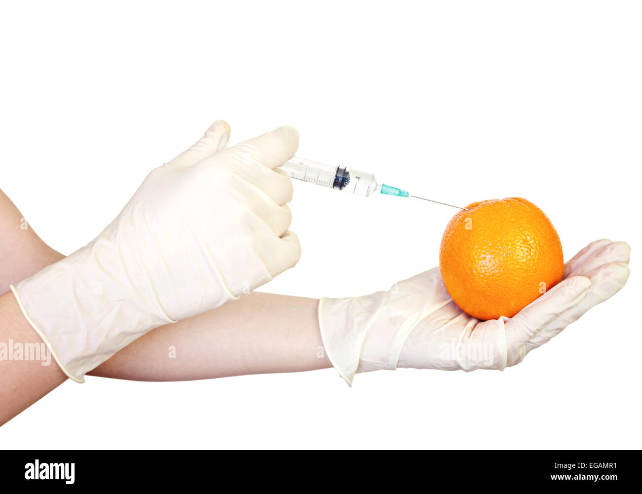 Injection into orange Stock Photo - Alamy