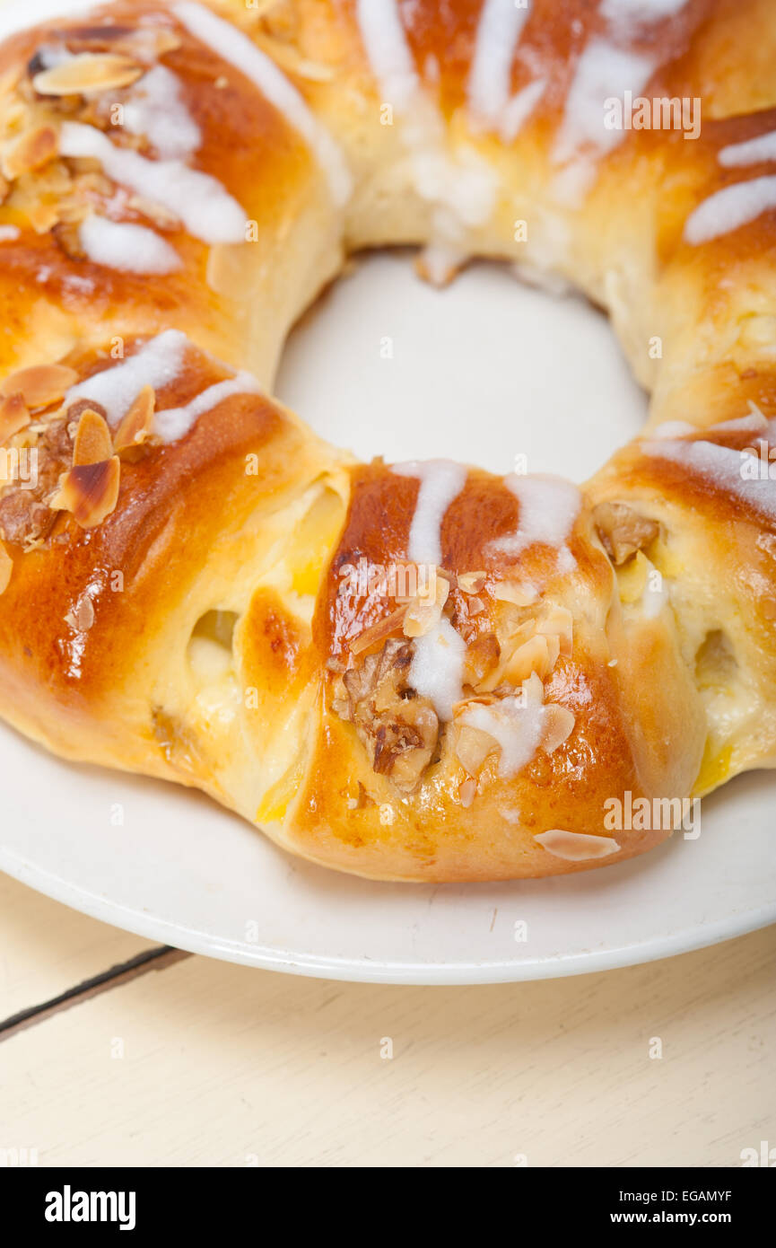 fresh home baked sweet bread donut cake with almonds and icing sugar on ...