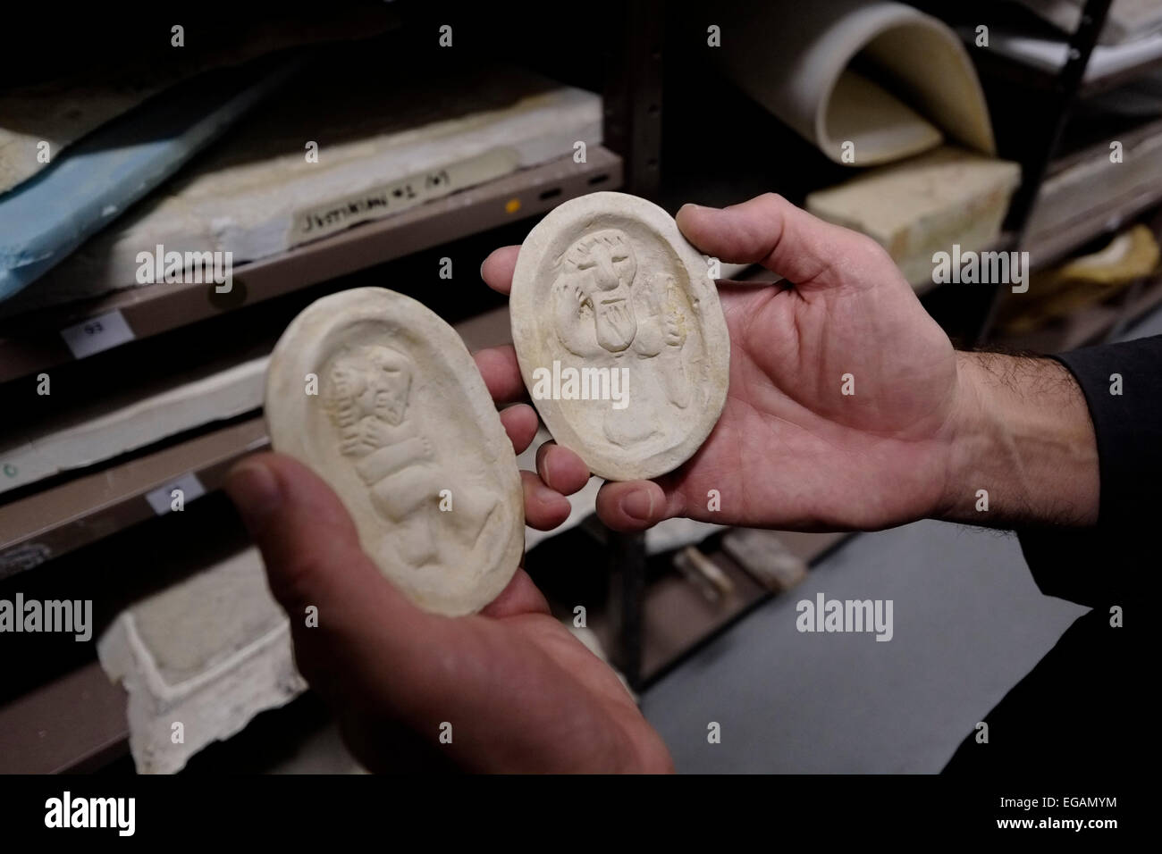 Andre Vainer Head of Object Conservation Laboratory holding ancient ...