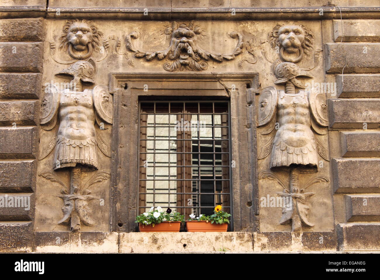 Renaissance window with flower pots and grate Stock Photo - Alamy