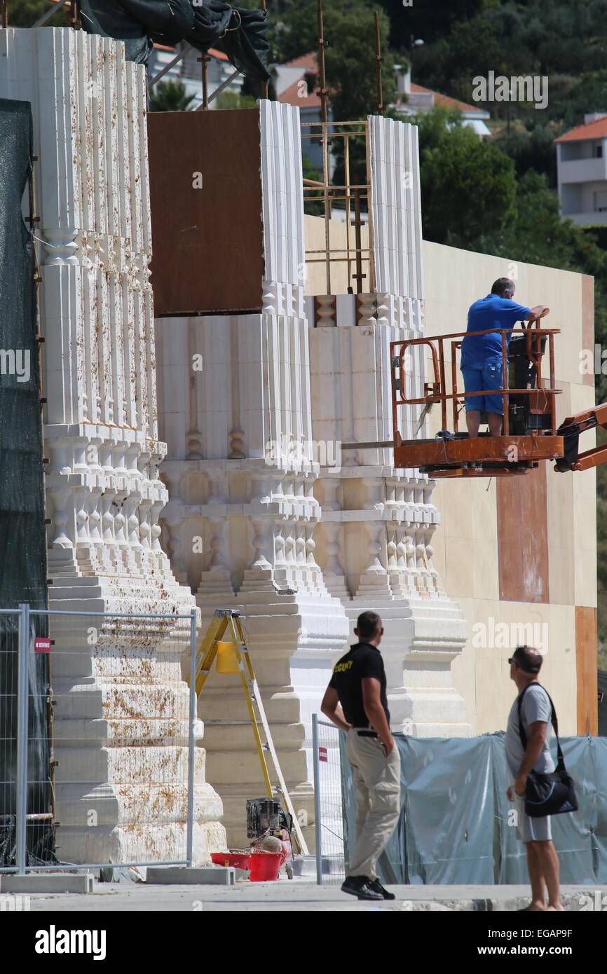 Set builders can be seen piecing together the facade of a pillared ...