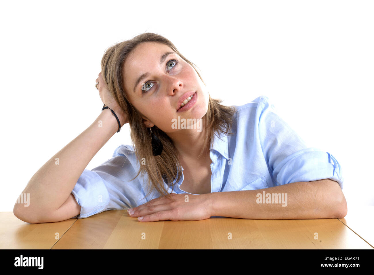 young woman lost in thought on the white background Stock Photo - Alamy