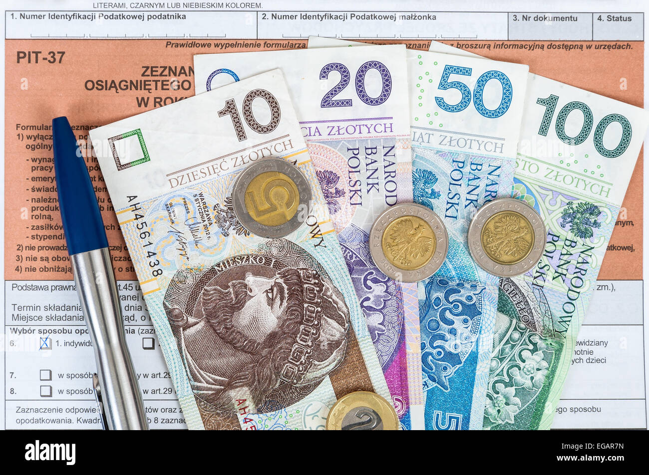 Polish individual tax form PIT-37 with money and pen Stock Photo - Alamy