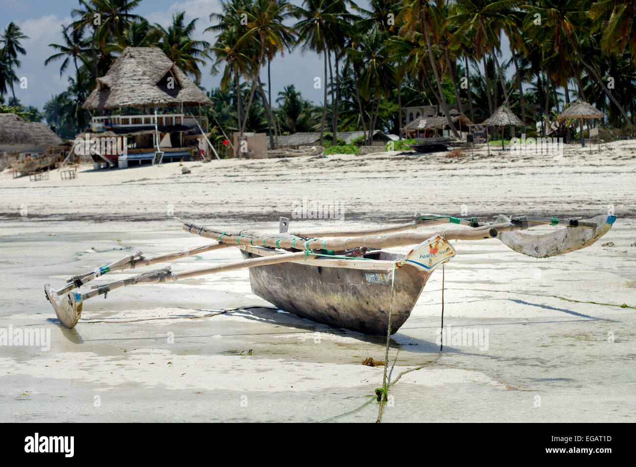 Ngalawa resting on the mudflats during low tide - Jambiani, Zanzibar ...
