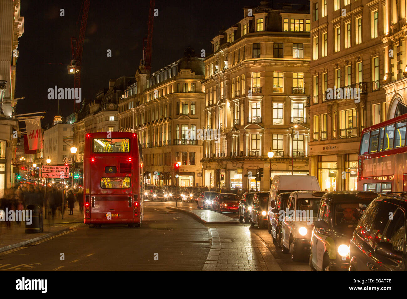 Rush hour on Regent Street, London, England on a damp winter evening ...