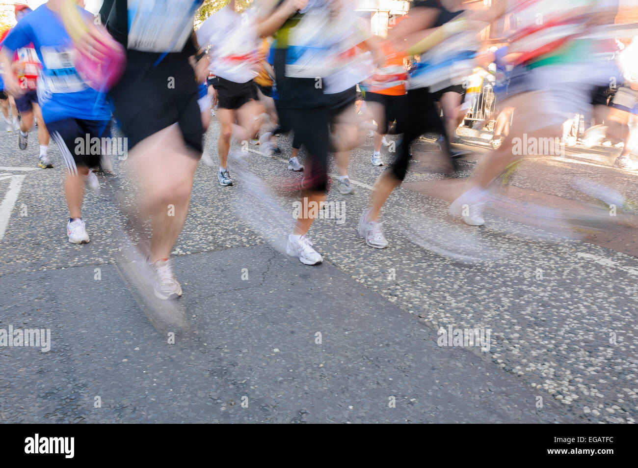 Runners in a marathon, with motion blur to emphasise speed Stock Photo ...