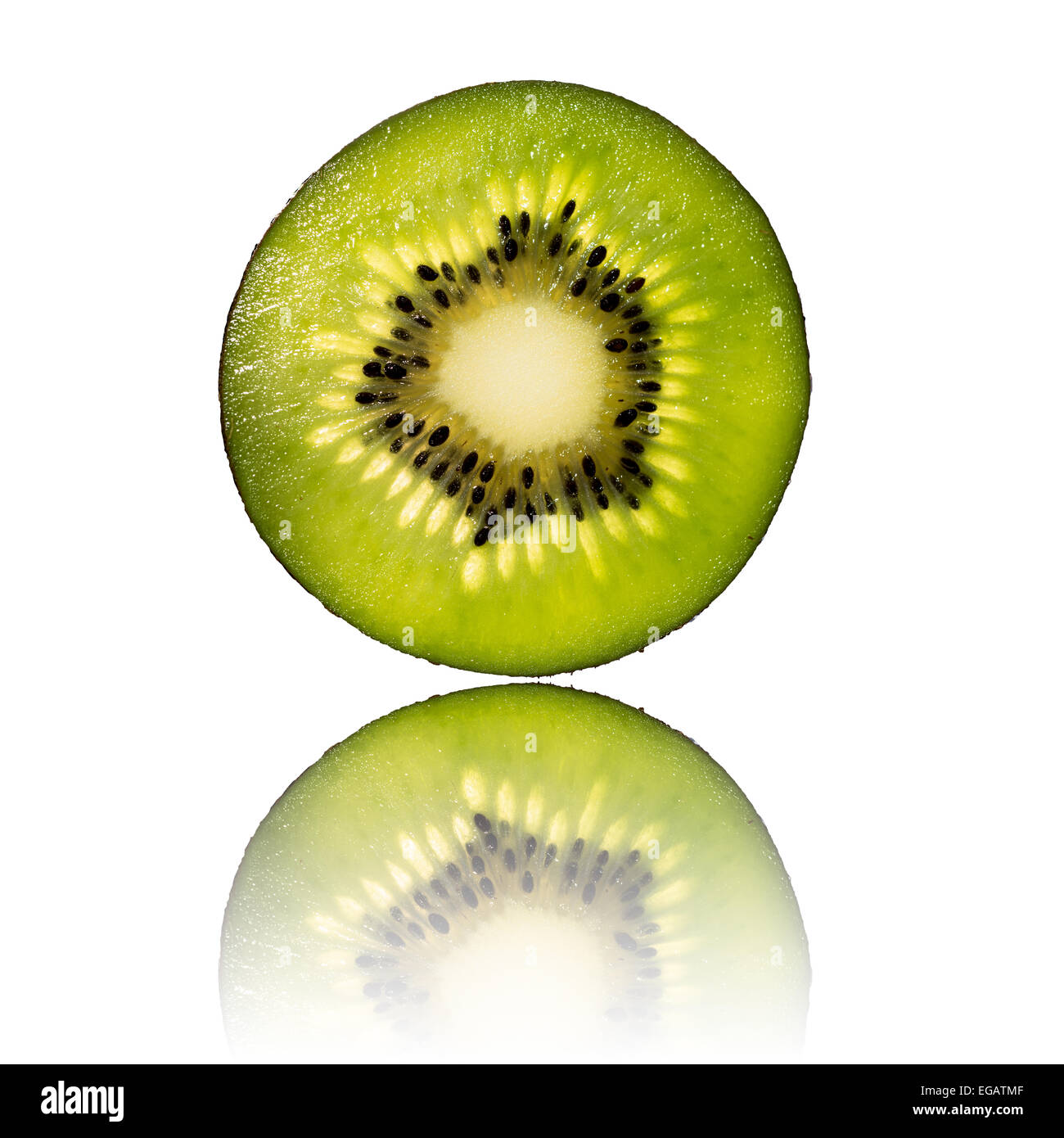 green kiwi slice isolated on white background back lighted and ...