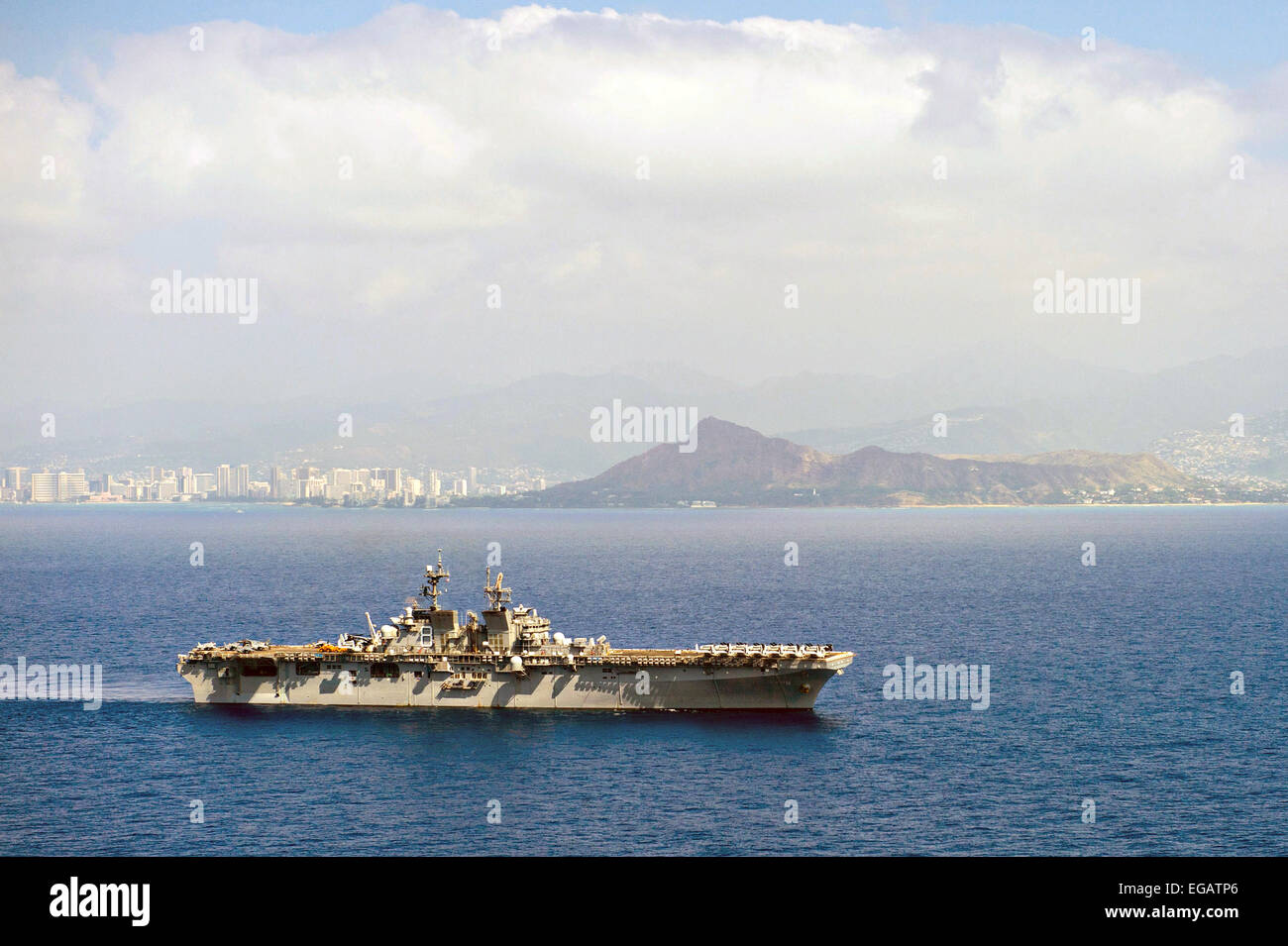 US Navy amphibious assault ship USS Makin Island sails past Waikiki ...