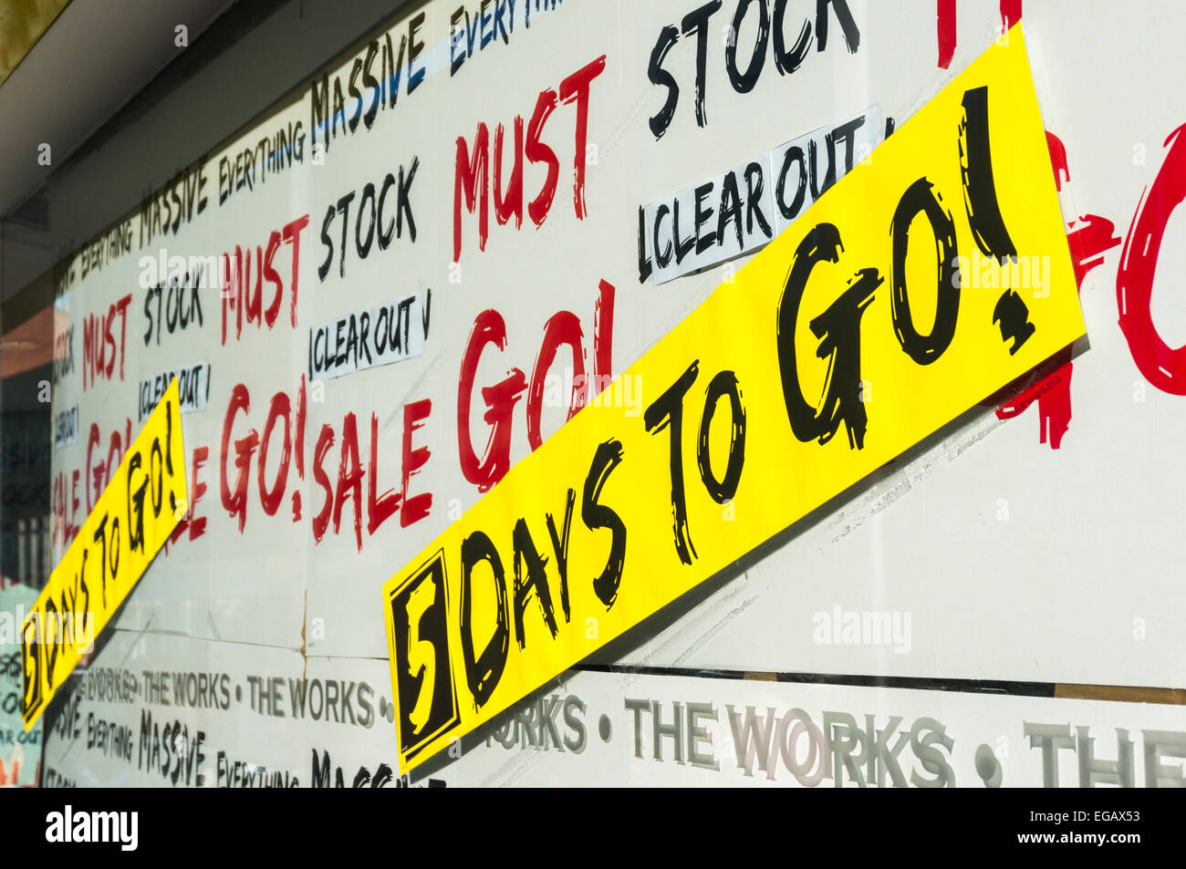Posters in the window of a shop declaring 'Everything must go' Stock ...