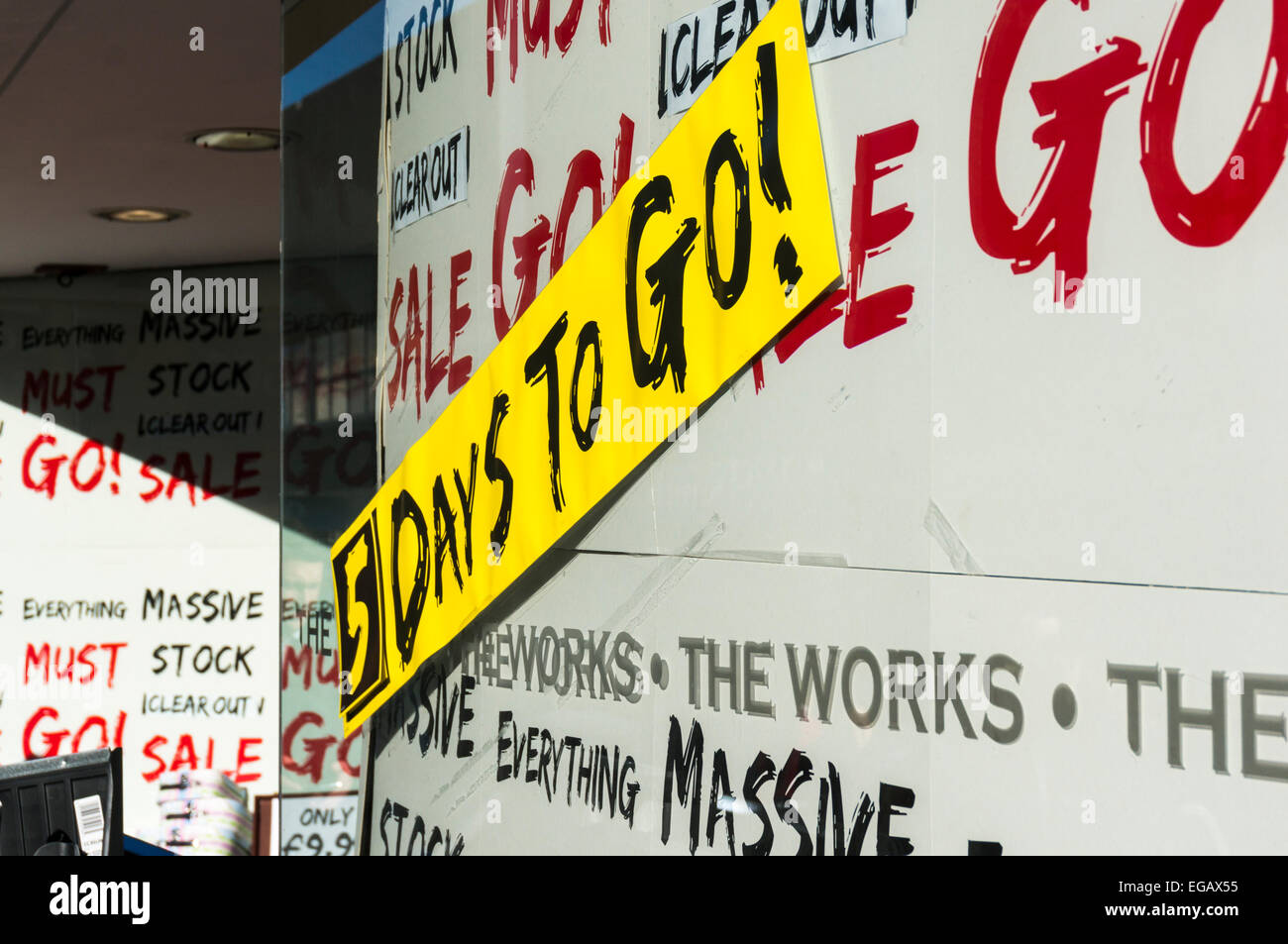 Posters in the window of a shop declaring 'Everything must go' Stock ...