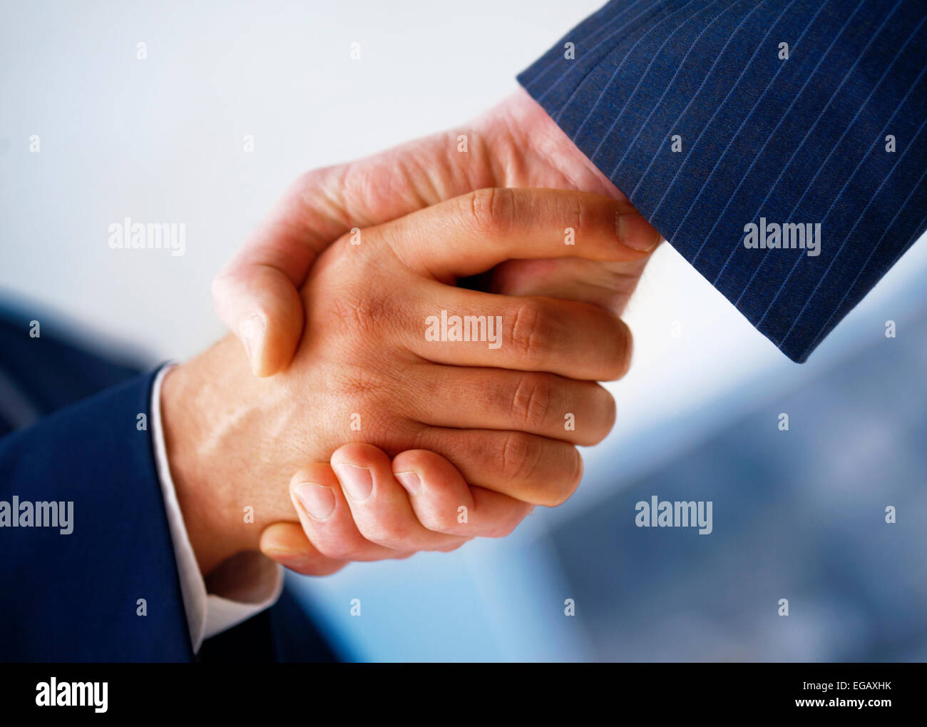 Closeup businesspeople shaking hands making hi-res stock photography ...